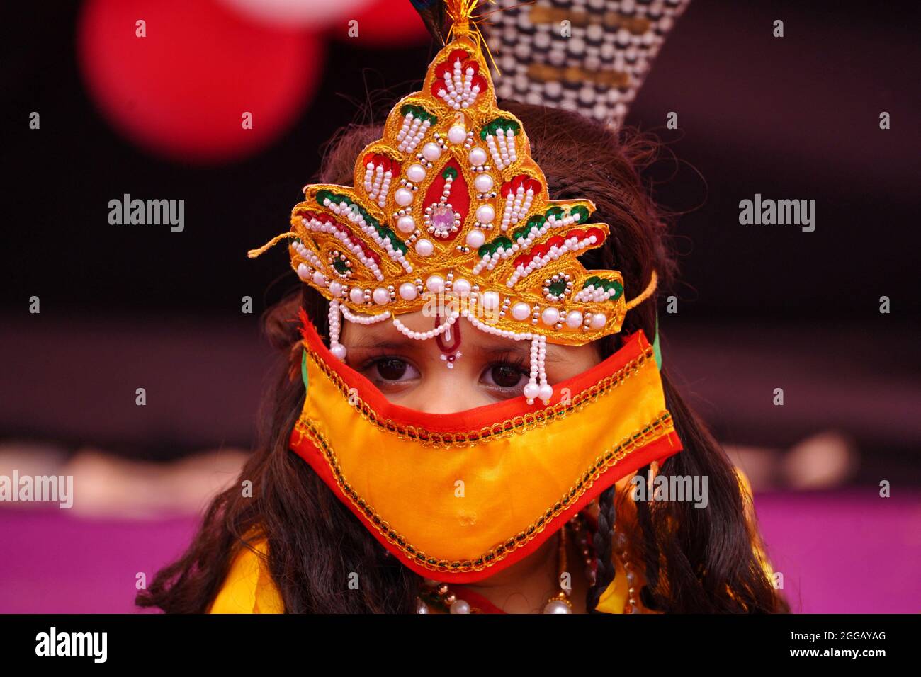 Indian Child wear face mask, Dressed As Hindu Lord Krishna, During The ...