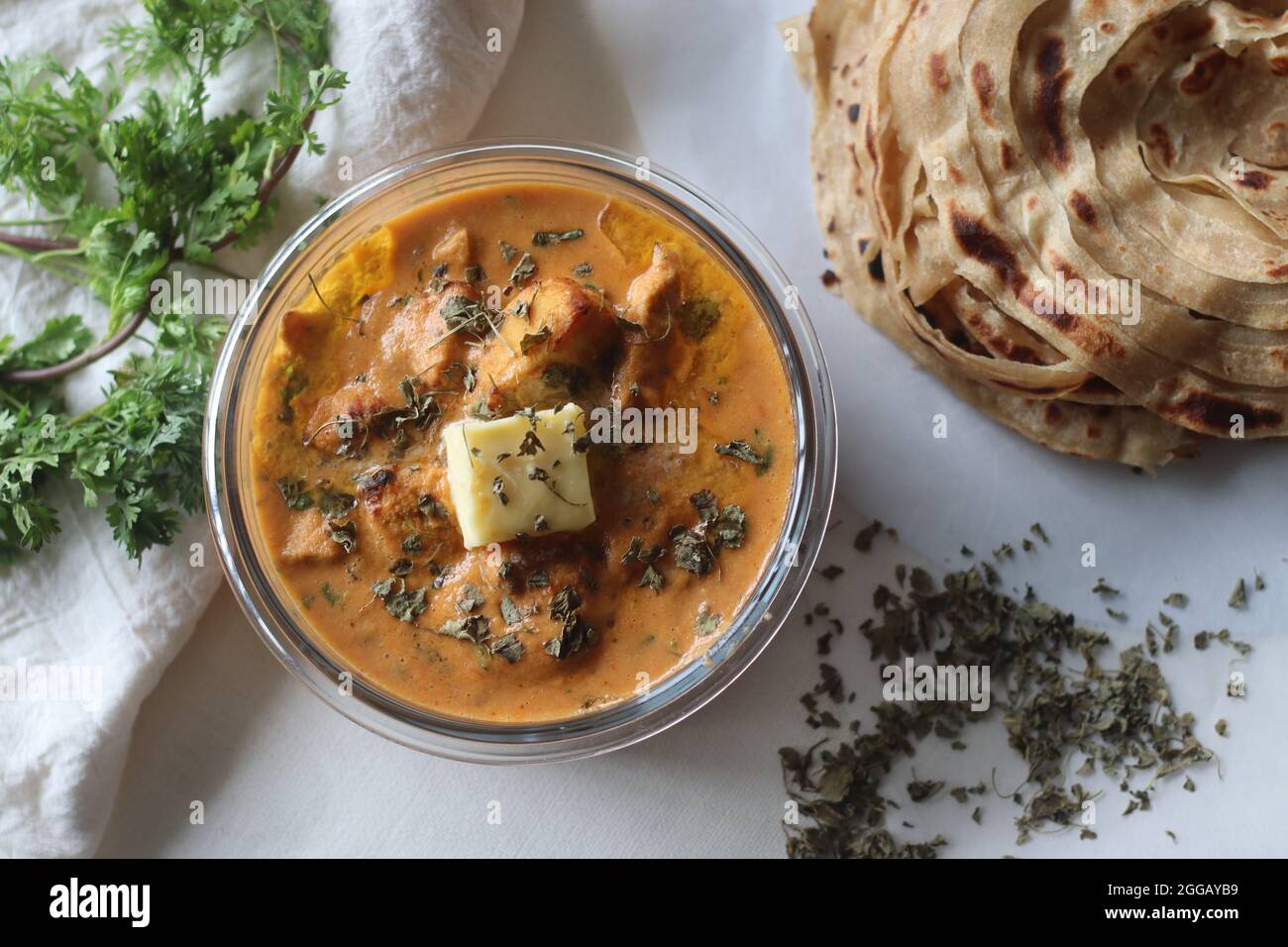 Butter chicken made of grilled chicken chunks cooked in buttery creamy ...