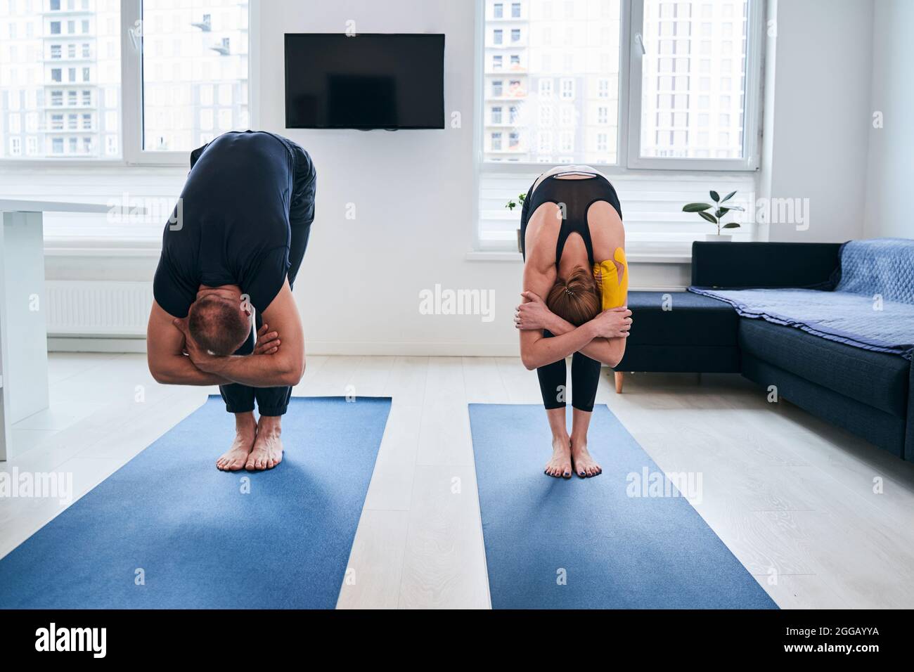 Forward fold yoga pose hi-res stock photography and images - Alamy