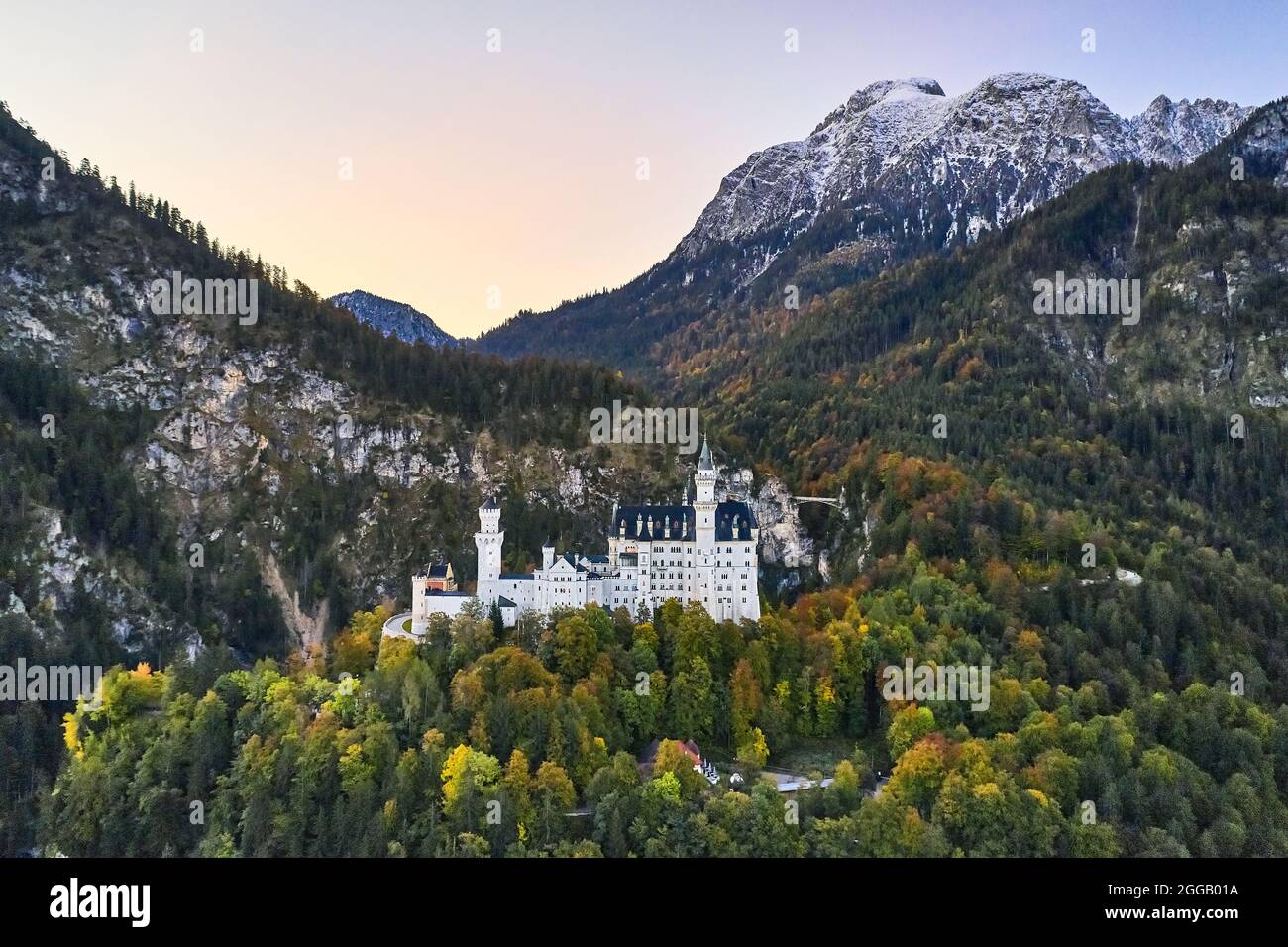 old white fairy tale castle in a mountain landscape Stock Photo - Alamy