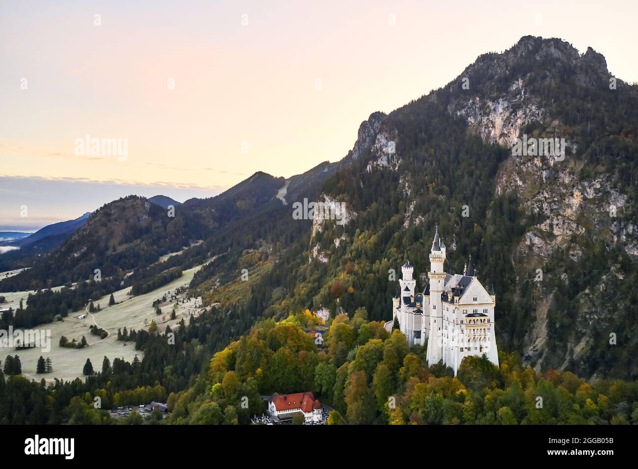 old white fairy tale castle in a mountain landscape Stock Photo - Alamy