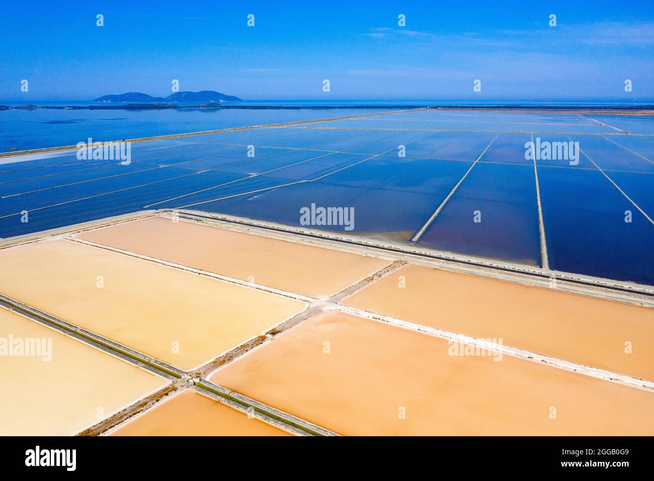 Aerial view of beautiful landscape of pink salt producing fields near ...