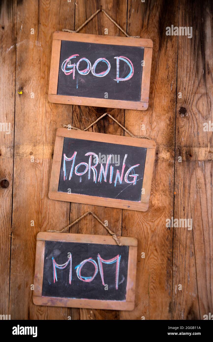 Graphic representation of the word, hello mom, written with chalk on ...