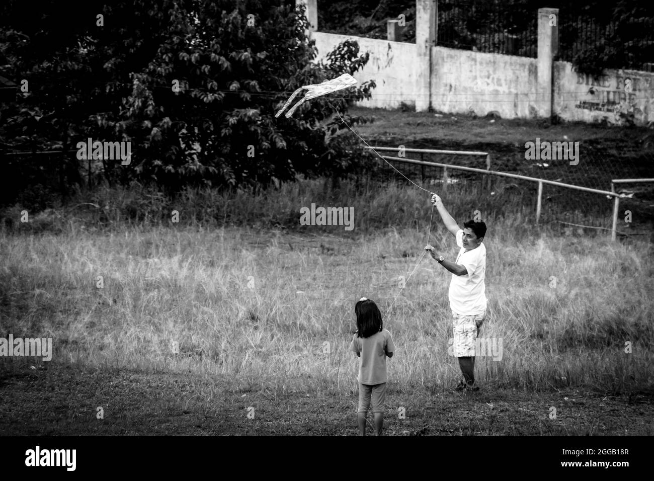 TAGAYTAY, PHILIPPINES - Aug 09, 2021: A grayscale of a father and ...