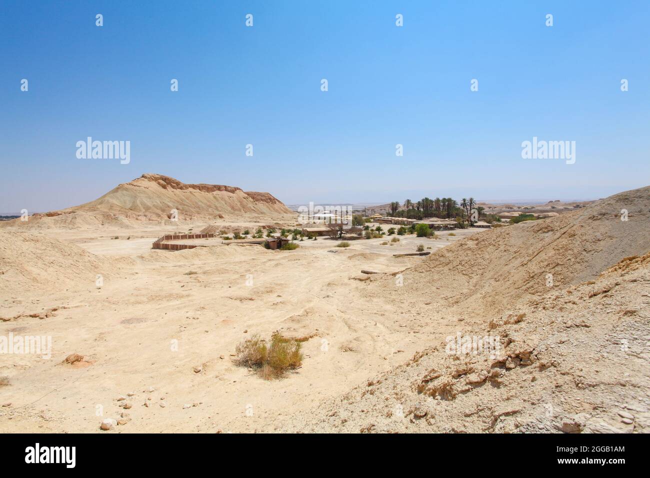 Desert landscape mud buildings around an oasis. Photographed in the ...