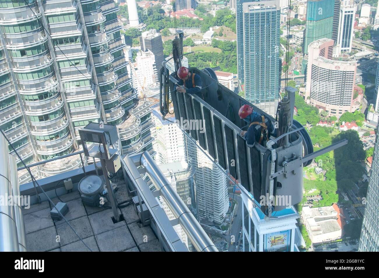 August 22, 2017. Kuala Lumpur, Malaysia. Window washers cleaning the ...