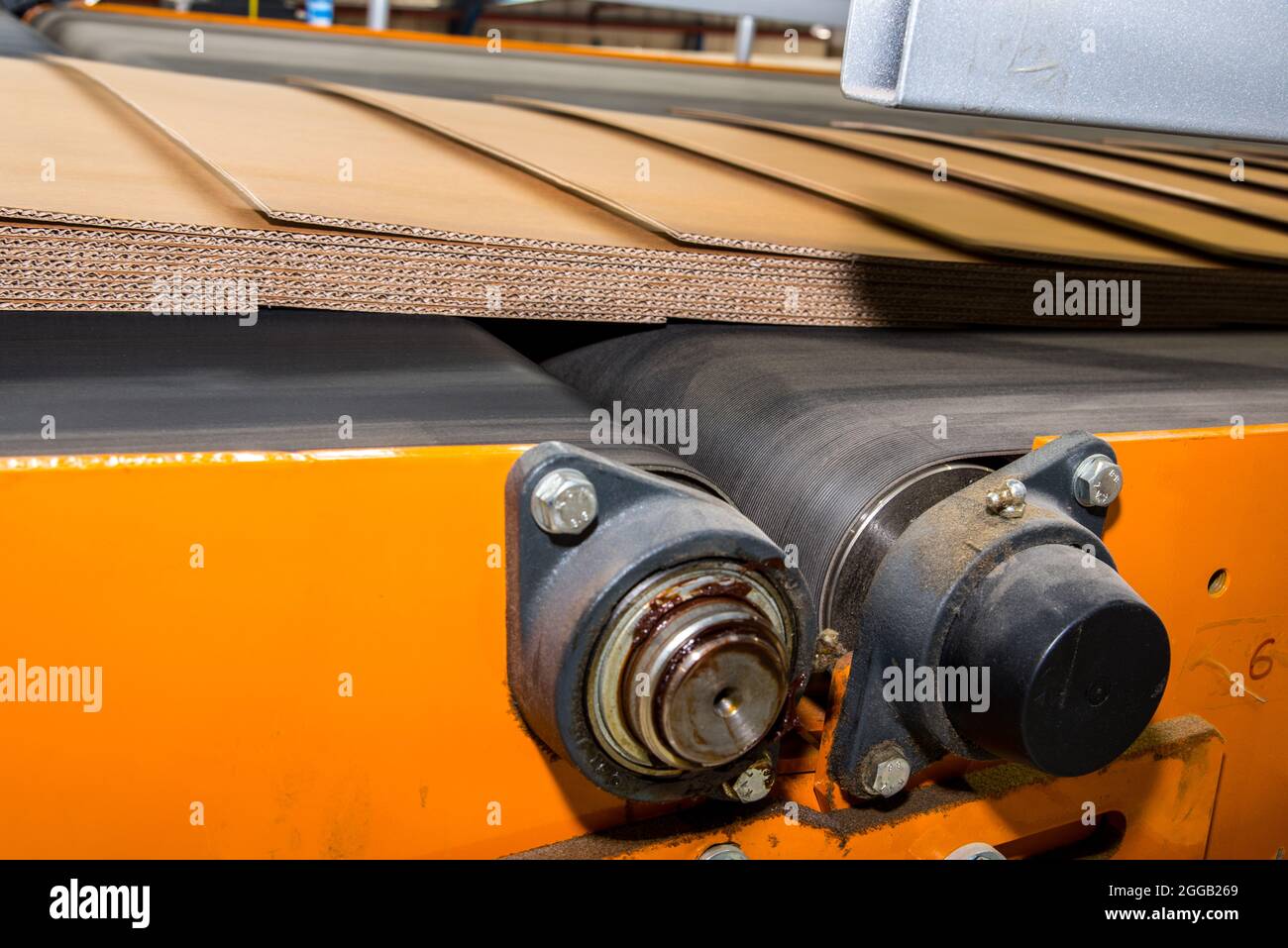 Paper is converted into corrugated cardboard made of multiple ...