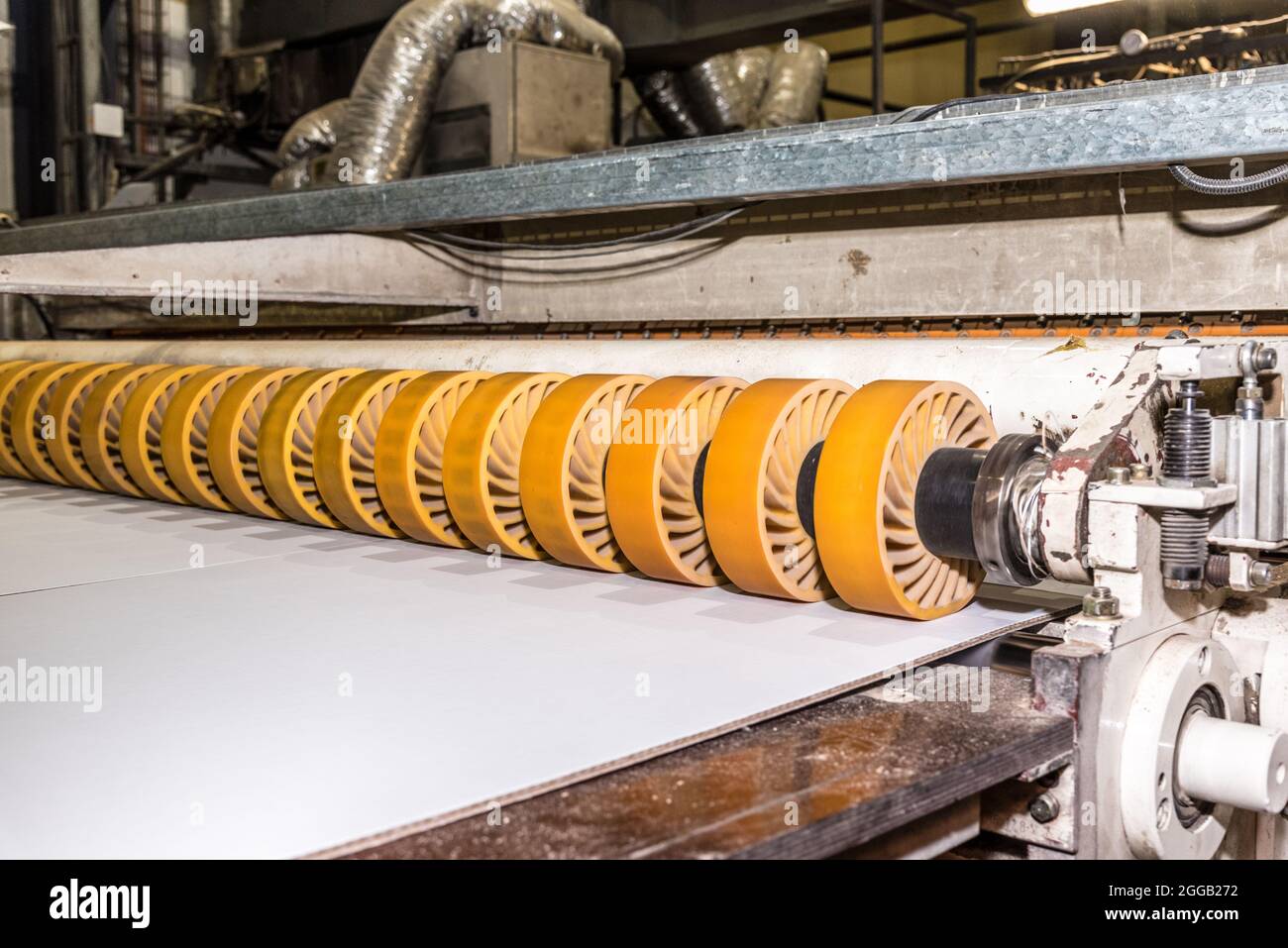 Paper is converted into corrugated cardboard made of multiple ...