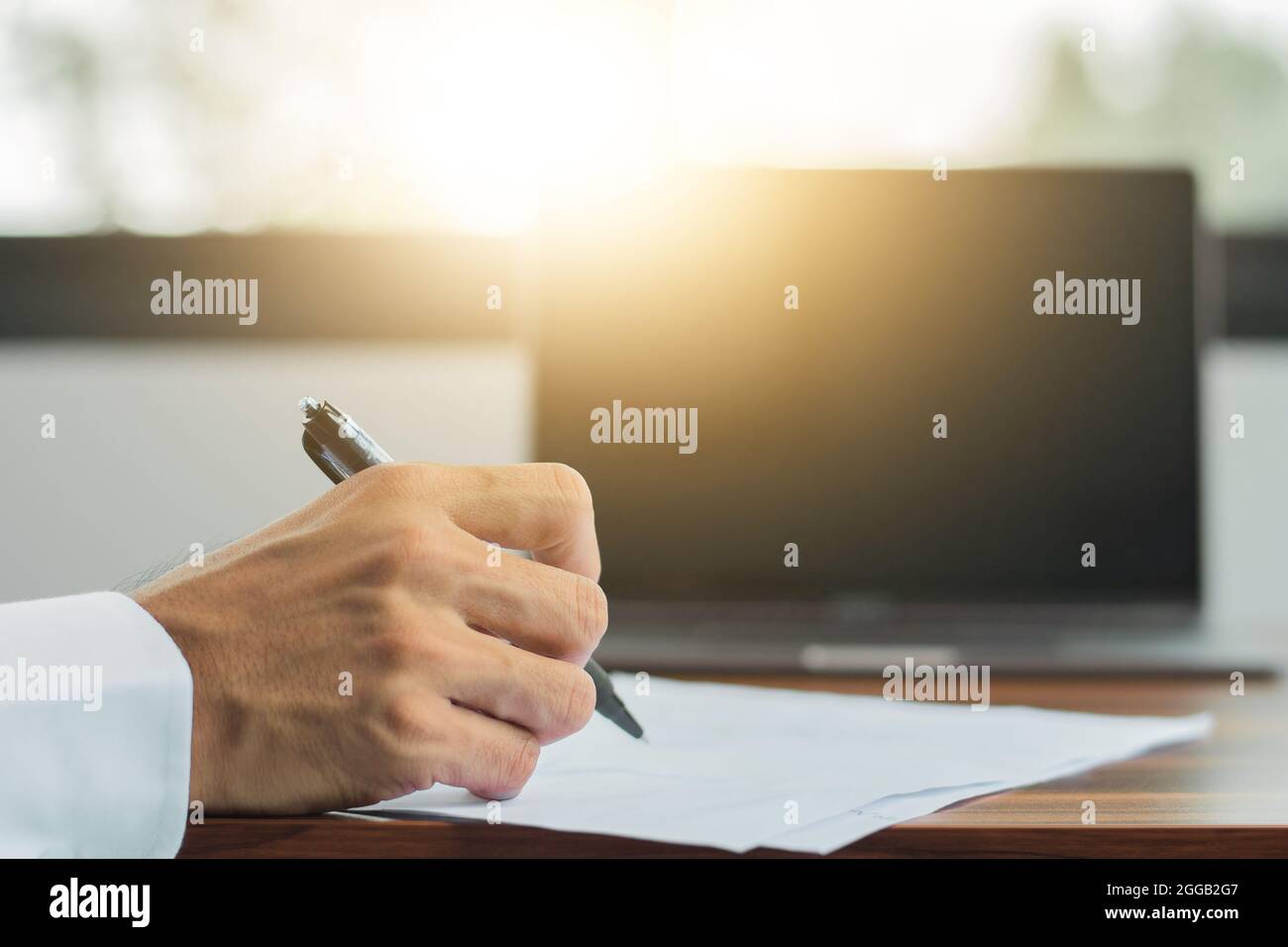 Hand signature on document , Hand holding pen writing Stock Photo - Alamy