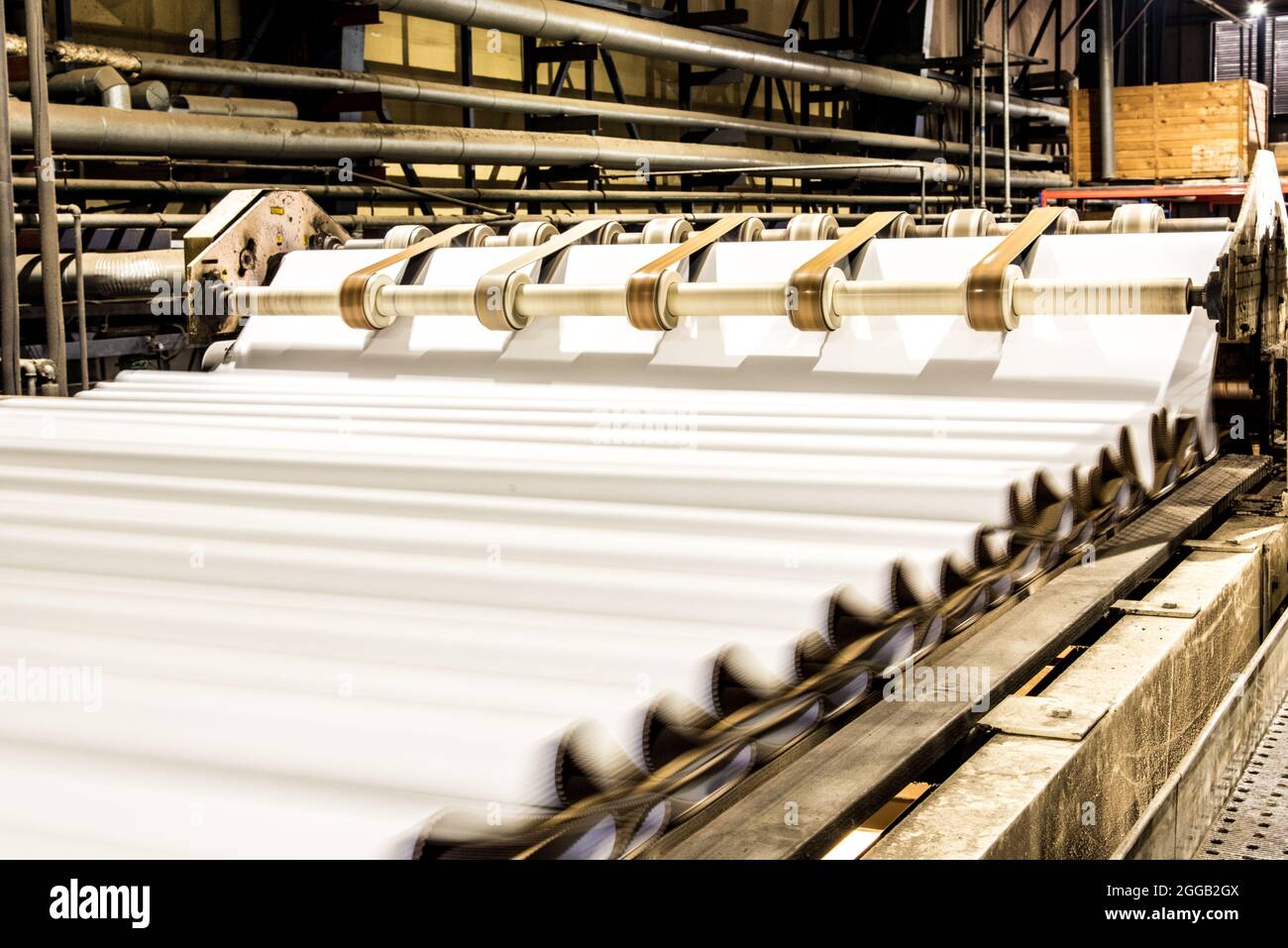 Paper is converted into corrugated cardboard made of multiple ...