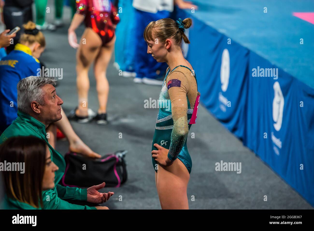 Australian Kate Sayer talks to her coach Mihai Brestyan during the ...
