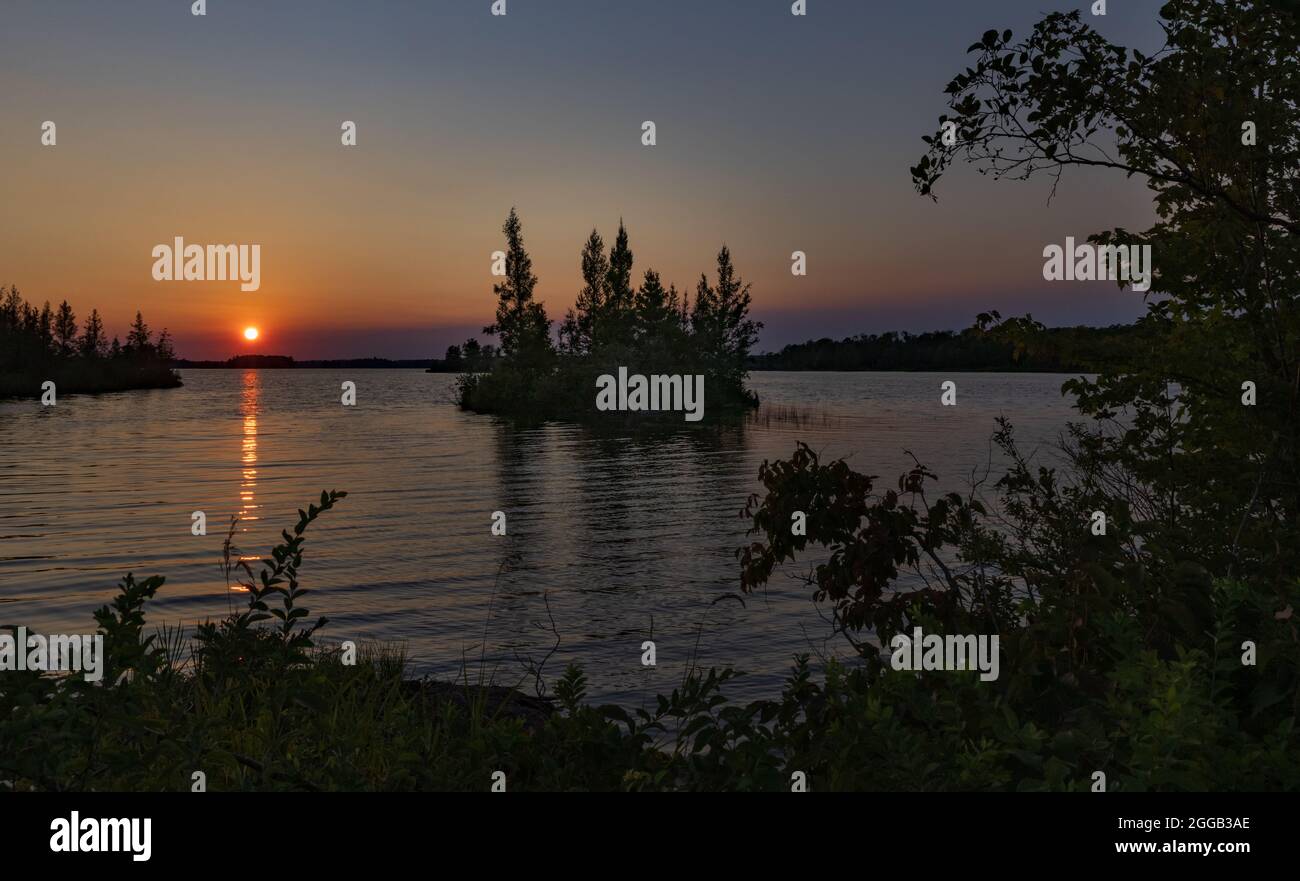 The sun setting over the Chippewa Flowage in northern Wisconsin Stock ...