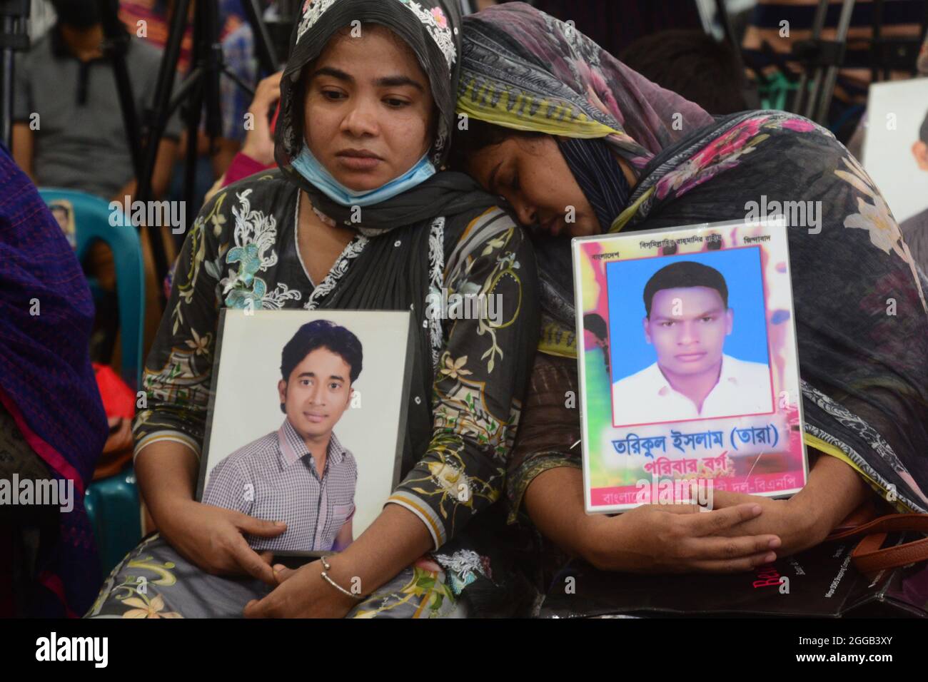Dhaka, Bangladesh. 30th Aug, 2021. Relatives hold portraits of their missing family members at ...