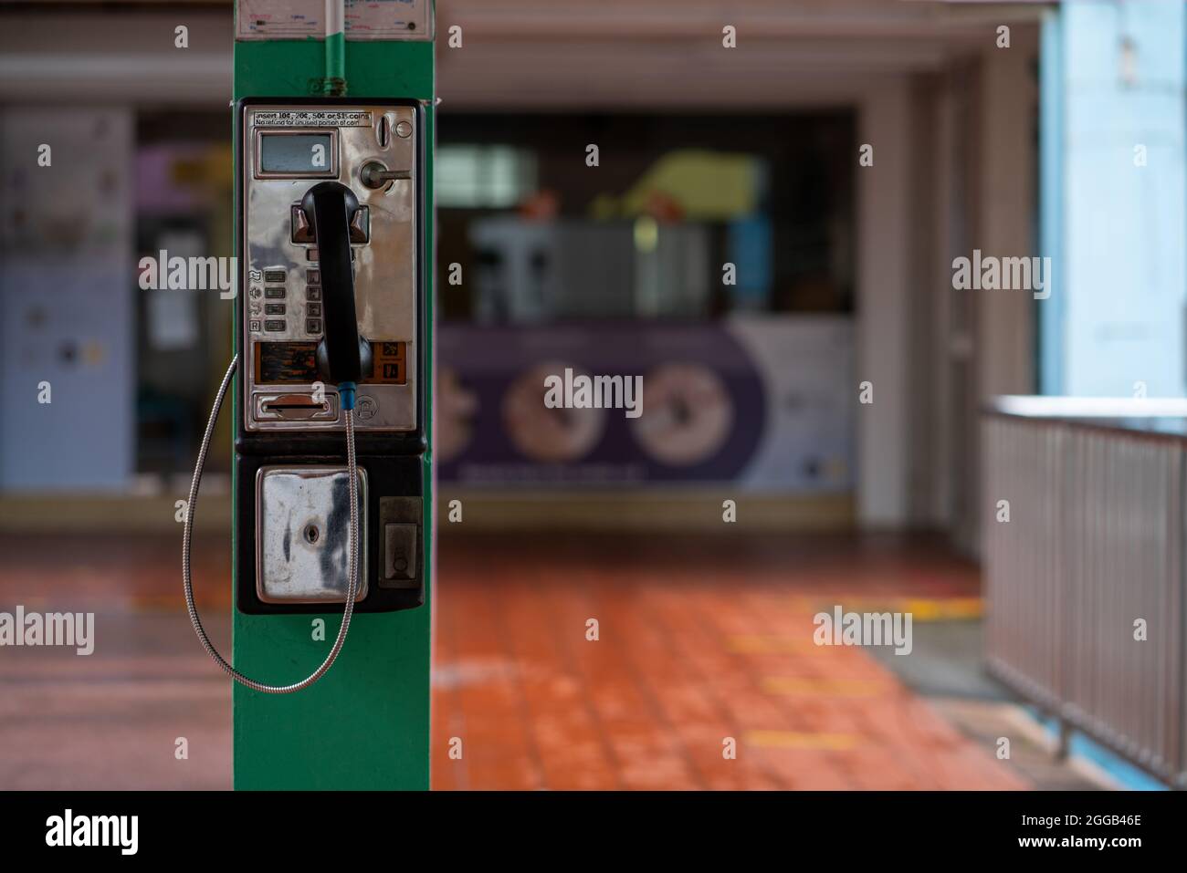 Public telephone in Singapore. Payphone coin-operated public telephone ...