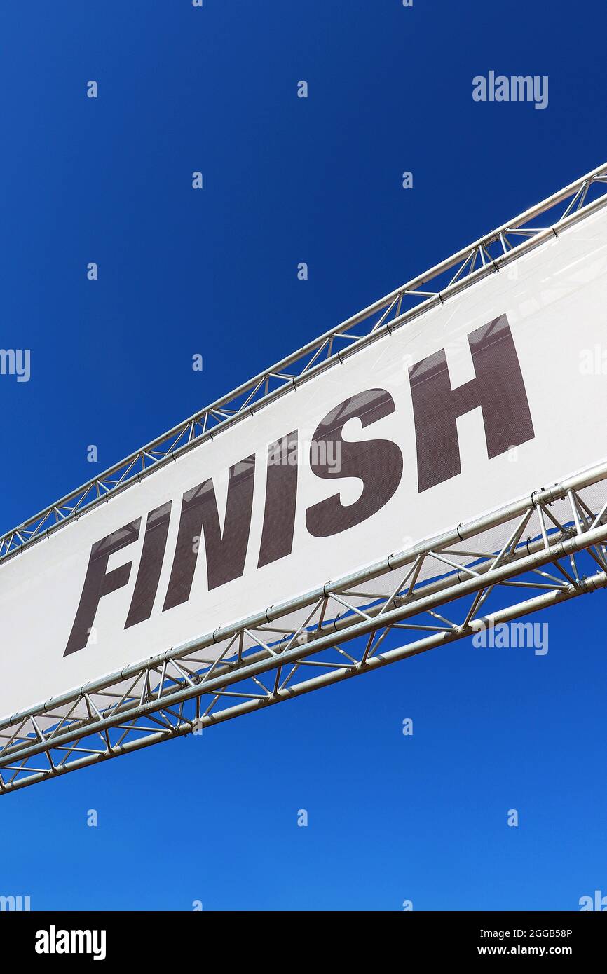 Finish line signage in metal frame isolated against a clear blue sky ...