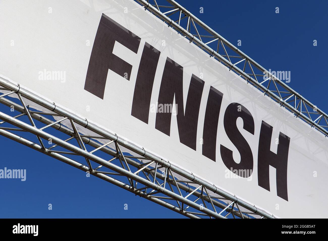 Finish line signage in metal frame isolated against a clear blue sky ...