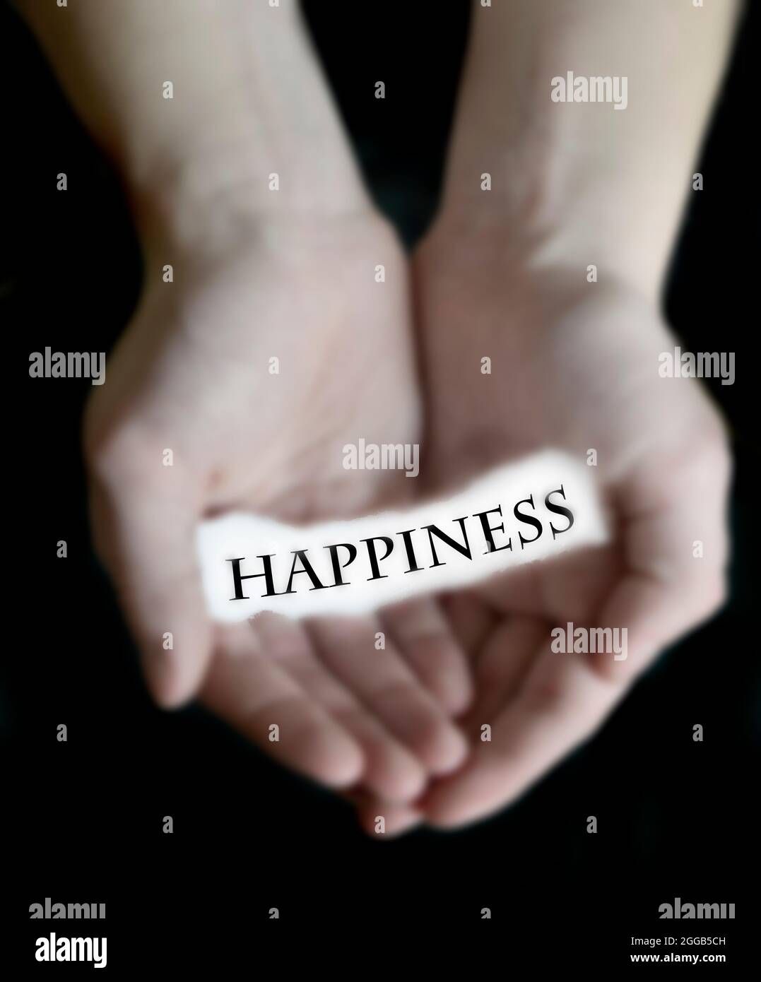 Hands holding happiness word sign on paper choosing to be happy Stock ...