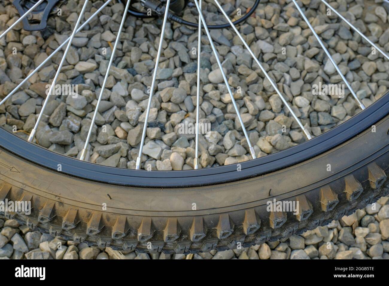 bike wheel close-up on the stone background. Bicycle detail. Flat tire ...