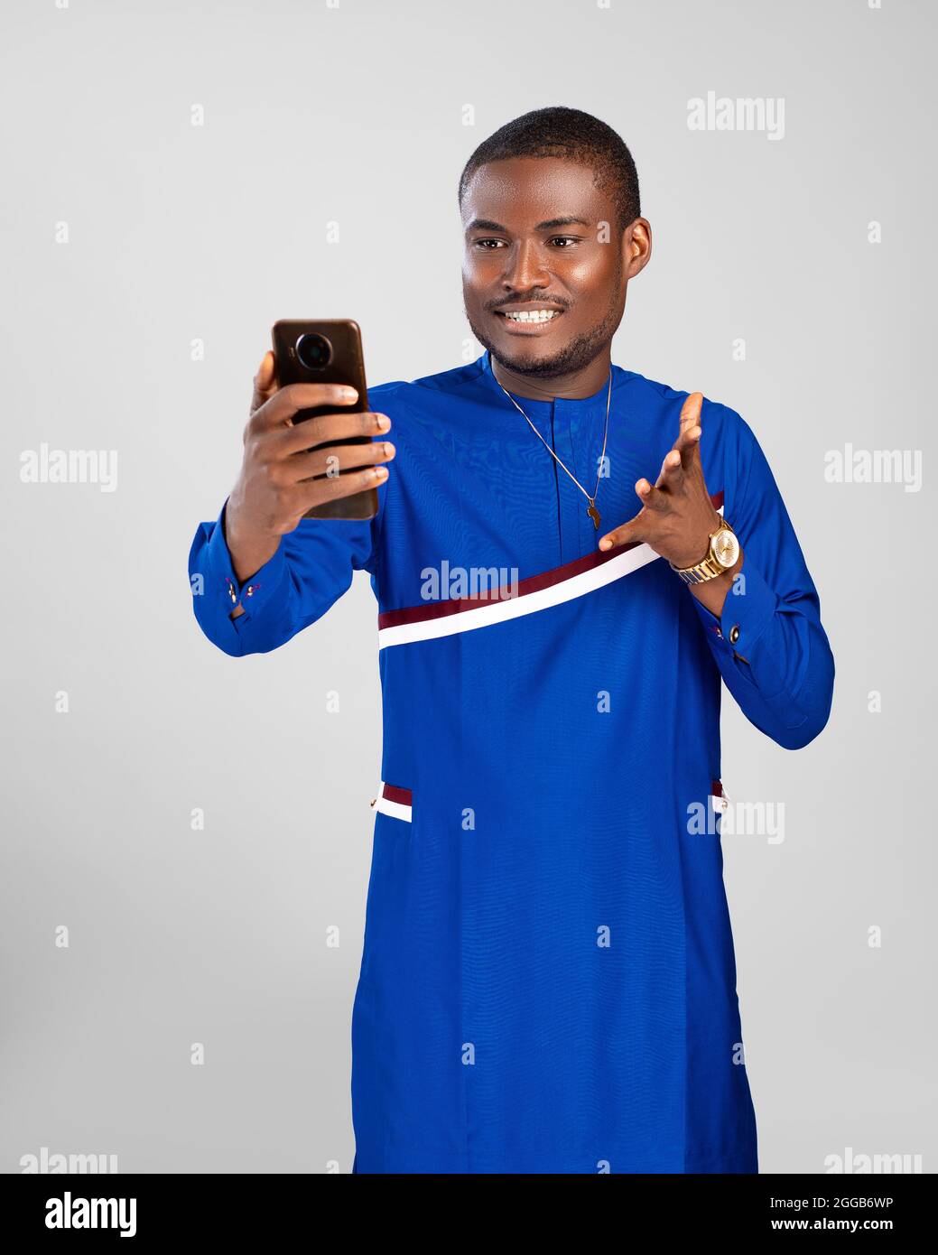 young african man explaining something over a video call to someone ...