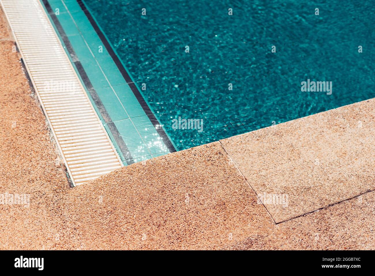 Detail of a swimming pool with filters on the sides and stone borders ...