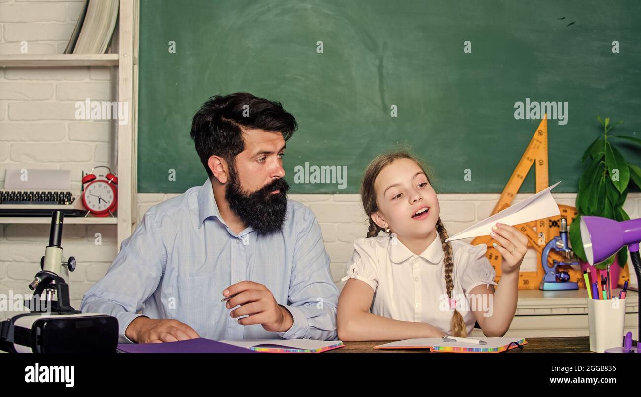 Creating a community of learners. Teacher and schoolgirl. Man bearded ...