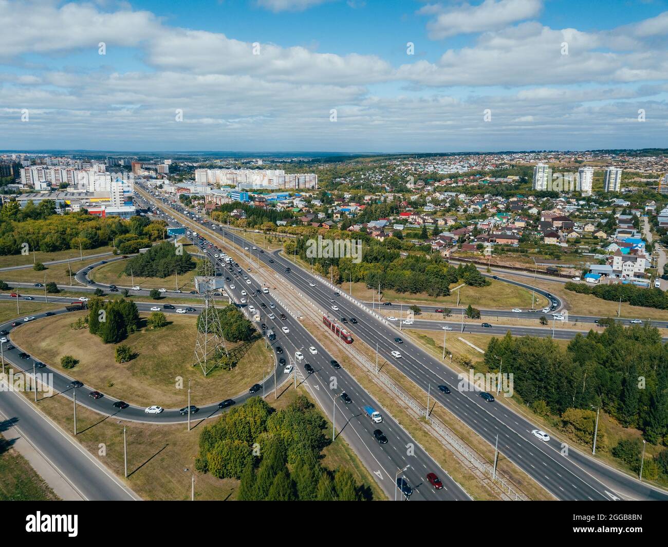 An expressway with a streetcar line in the middle of the road.. Kazan ...
