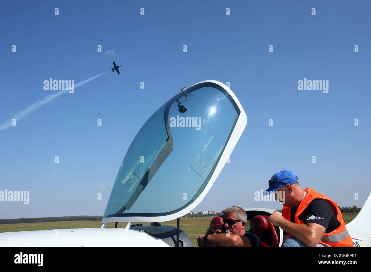 KHARKIV REGION, UKRAINE - AUGUST 28, 2021 - A pilot sits in the cockpit ...
