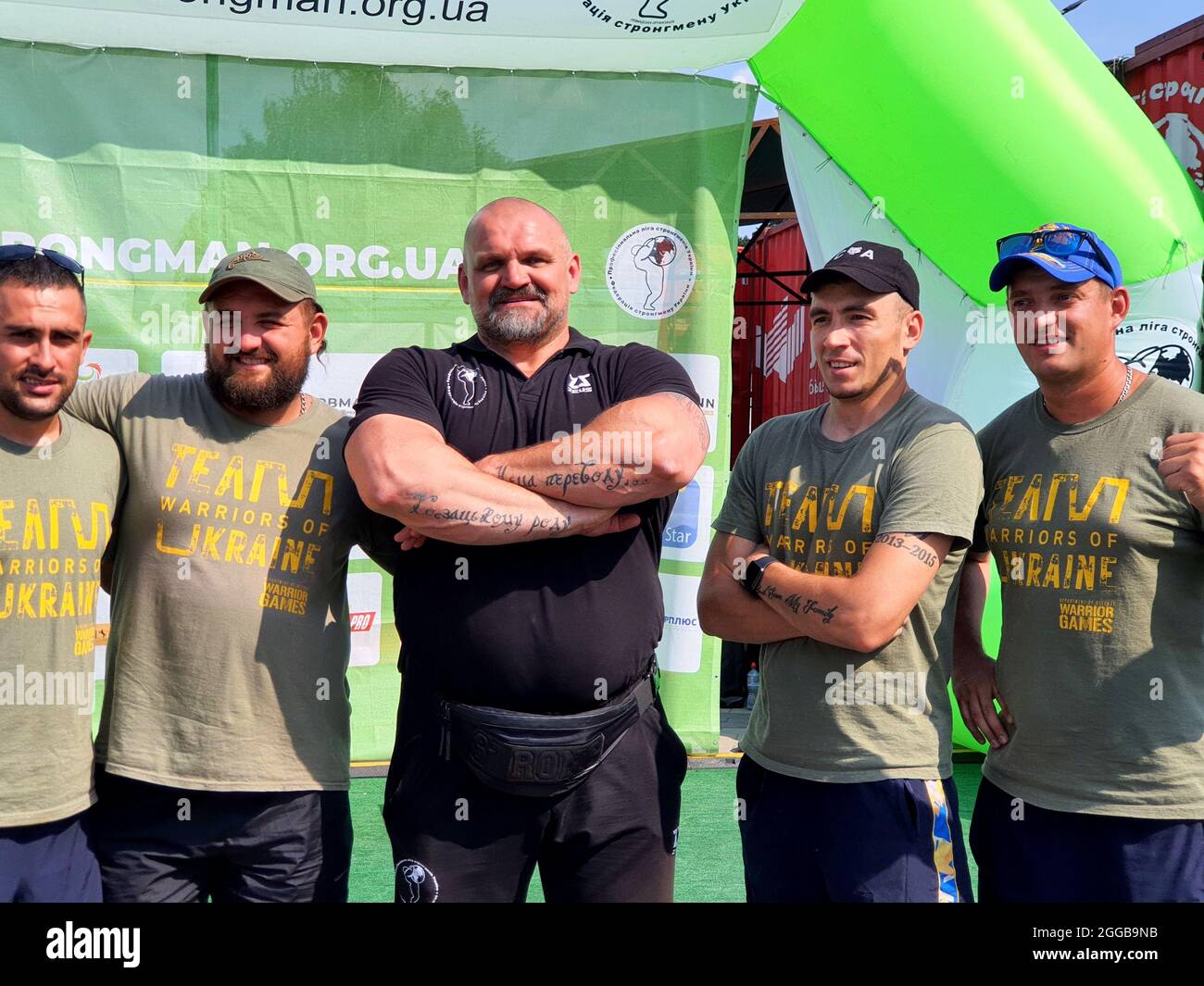 Vasily Virastyuk stands with the participants of the competition ...