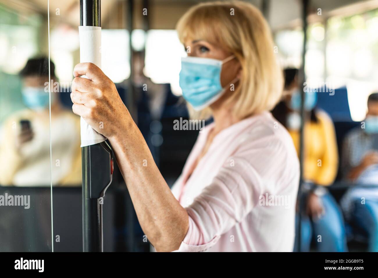 Old lady standing bus hi-res stock photography and images - Alamy