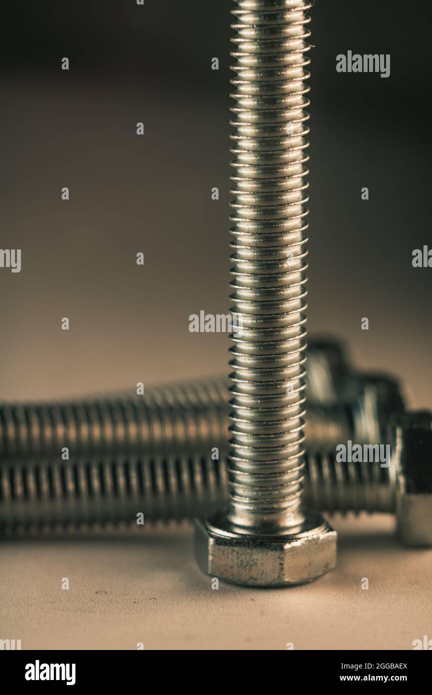 Vertical shot of hexagonal bolt nut screws under spotlight Stock Photo ...