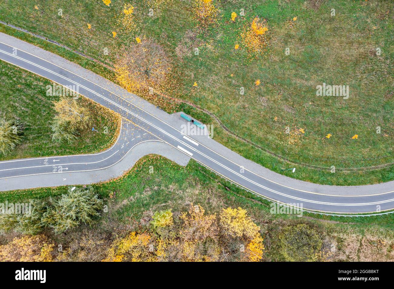 bicycle lane and walking path in public park. cloudy autumn day. aerial ...