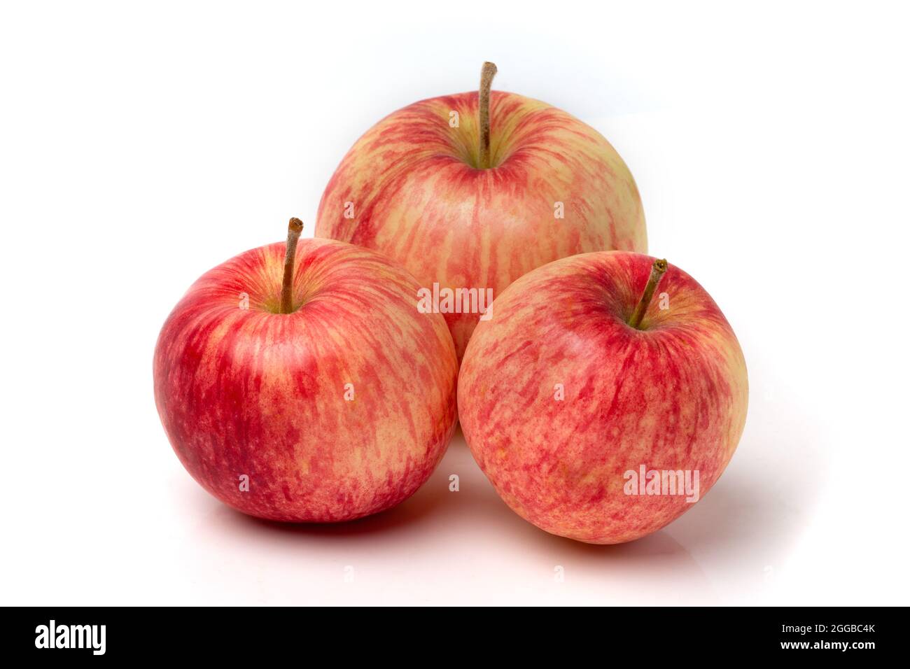 Three colorful pink apples on a white background Stock Photo - Alamy