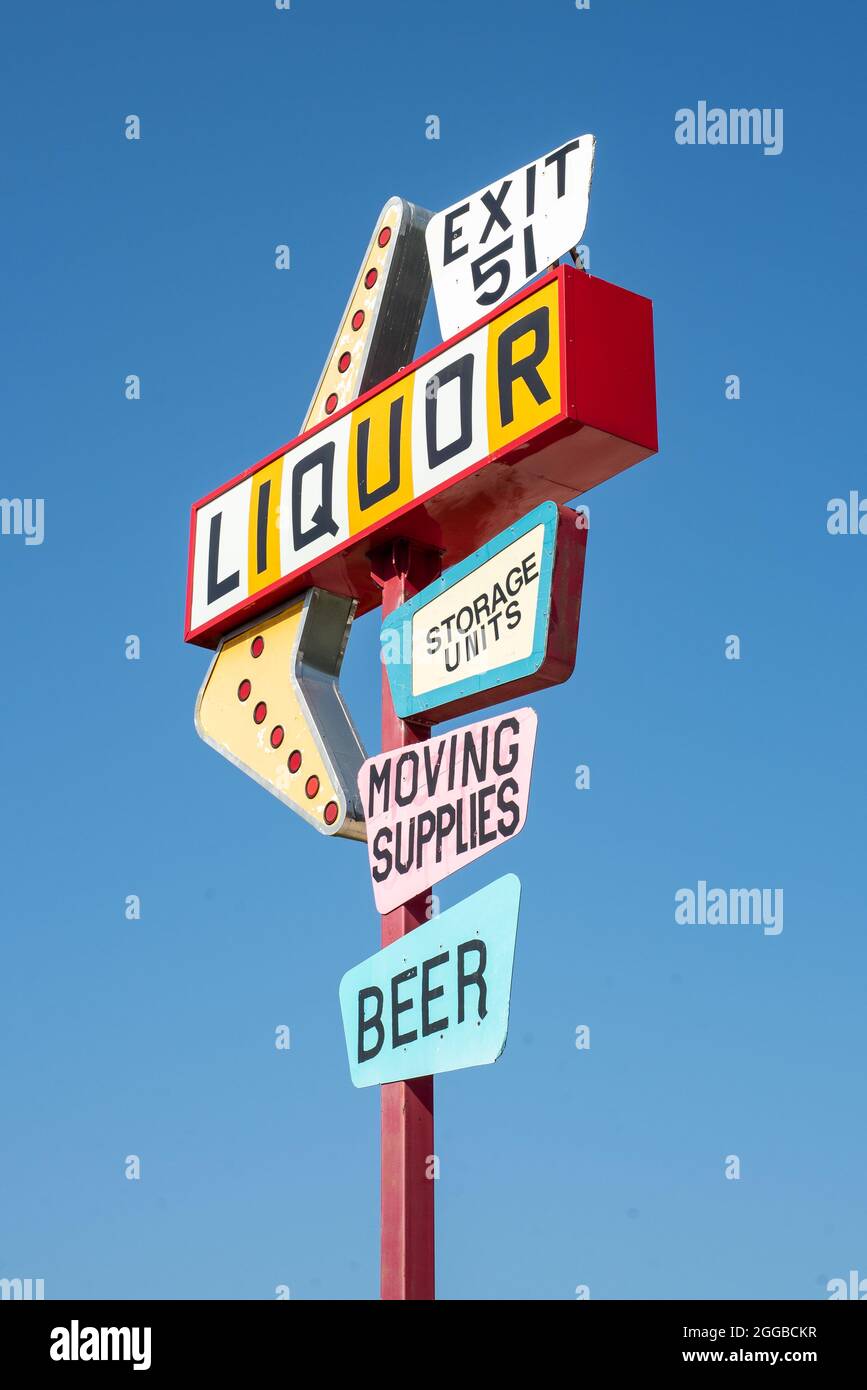 Vintage colorful retro roadside liquor sign Stock Photo - Alamy