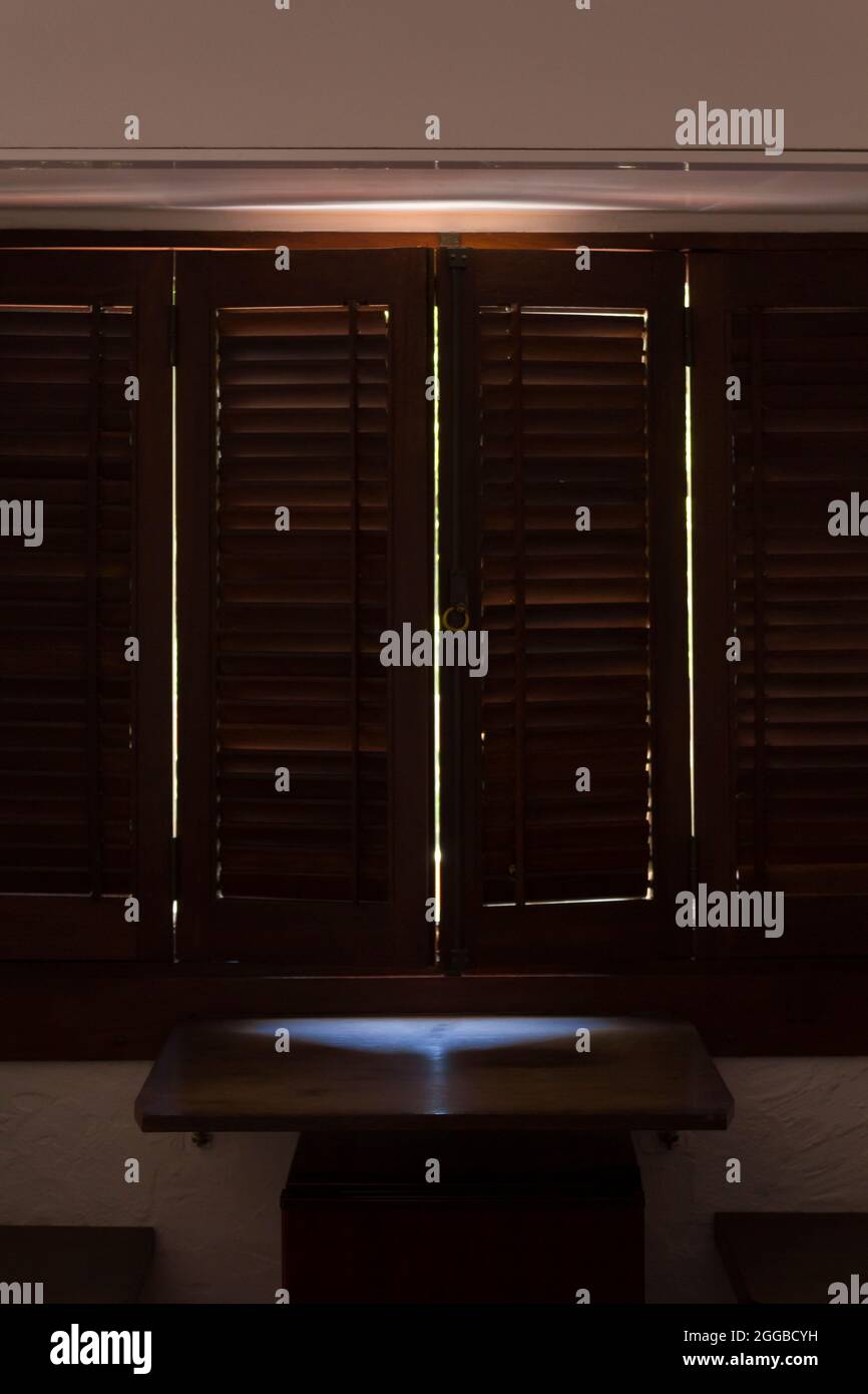 Wooden window shutters and wooden table and benches Stock Photo - Alamy