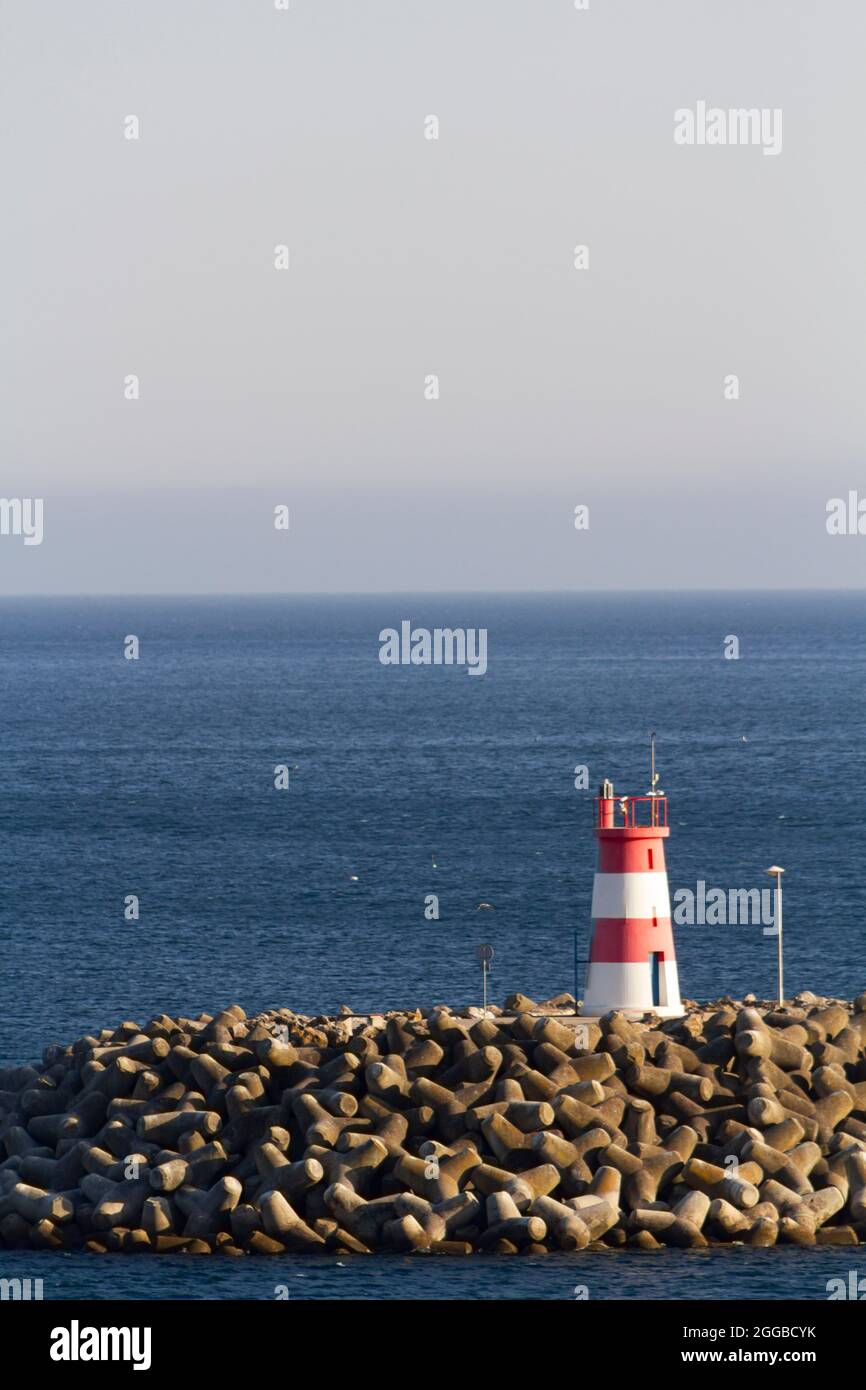 Lighthouse with sea on the background Stock Photo - Alamy