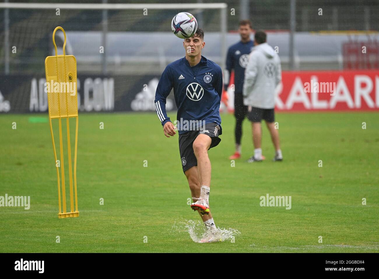 Wet football pitch with ball hi-res stock photography and images - Alamy
