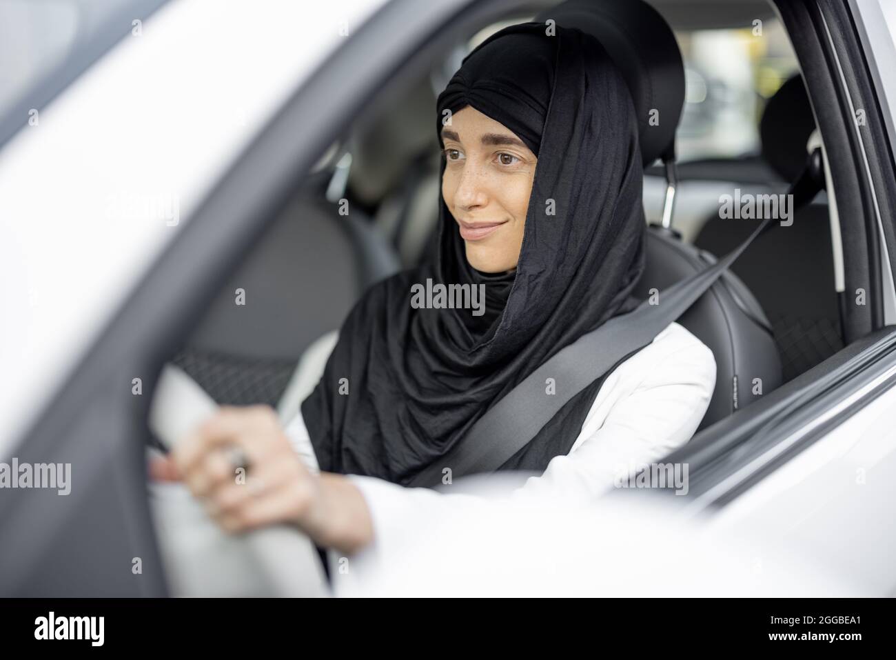 Muslim woman drives a car Stock Photo - Alamy