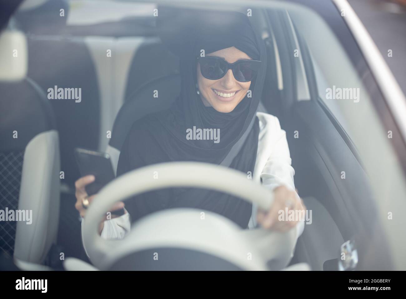 Muslim woman drives a car Stock Photo - Alamy