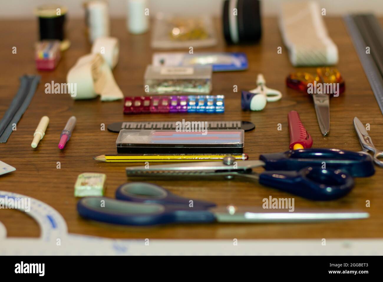 Accessories for tailoring on wooden traditional table Stock Photo - Alamy
