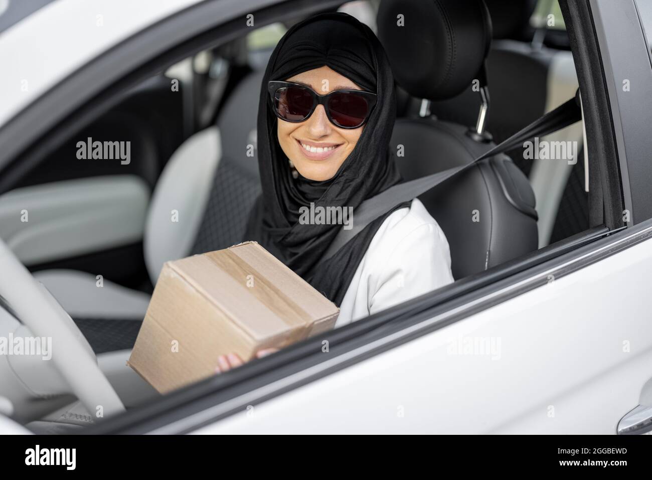 Muslim woman drives a car Stock Photo - Alamy