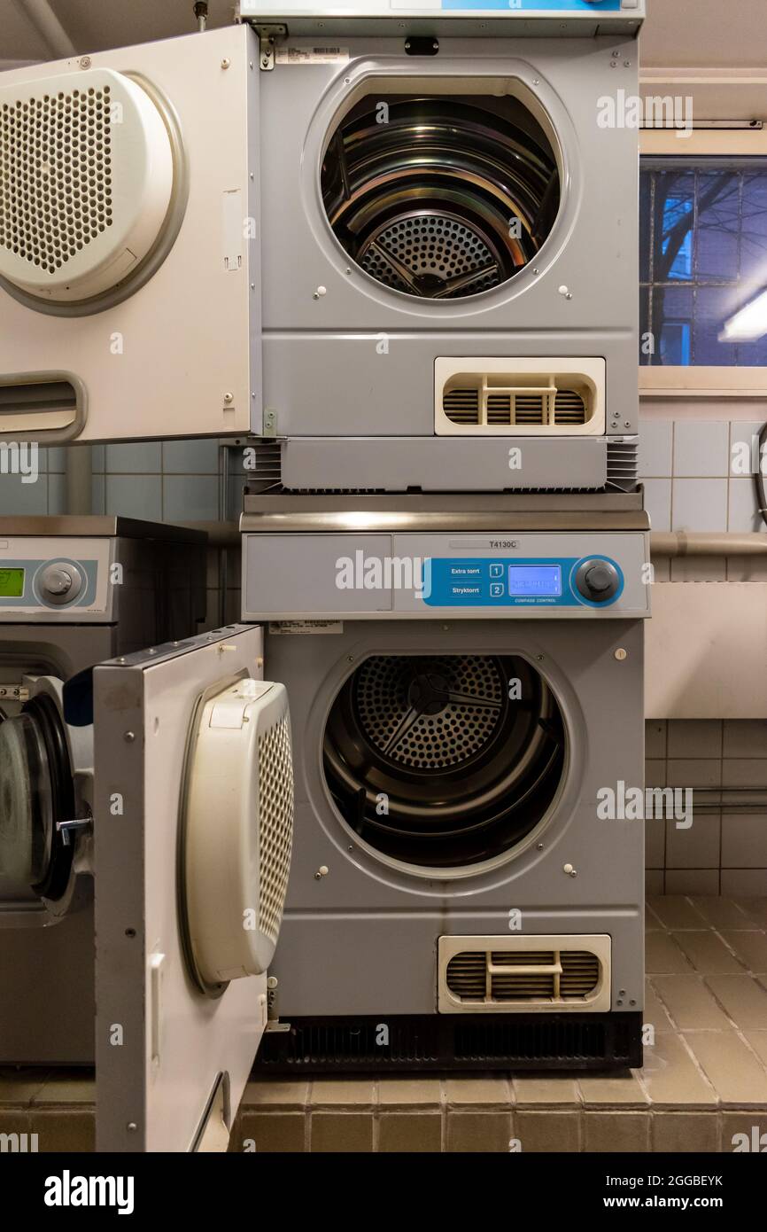 An image of two dryer machines in a public laundry room Stock Photo - Alamy
