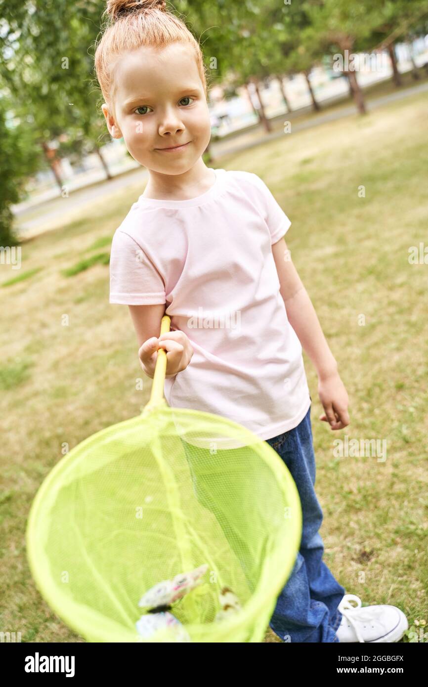 Little girl playing with butterfly net. Summer adventure. Happy toddler ...