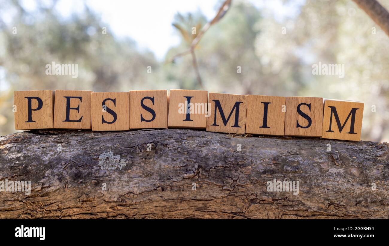 The word pessimism was created from wooden cubes. Photographed on the ...