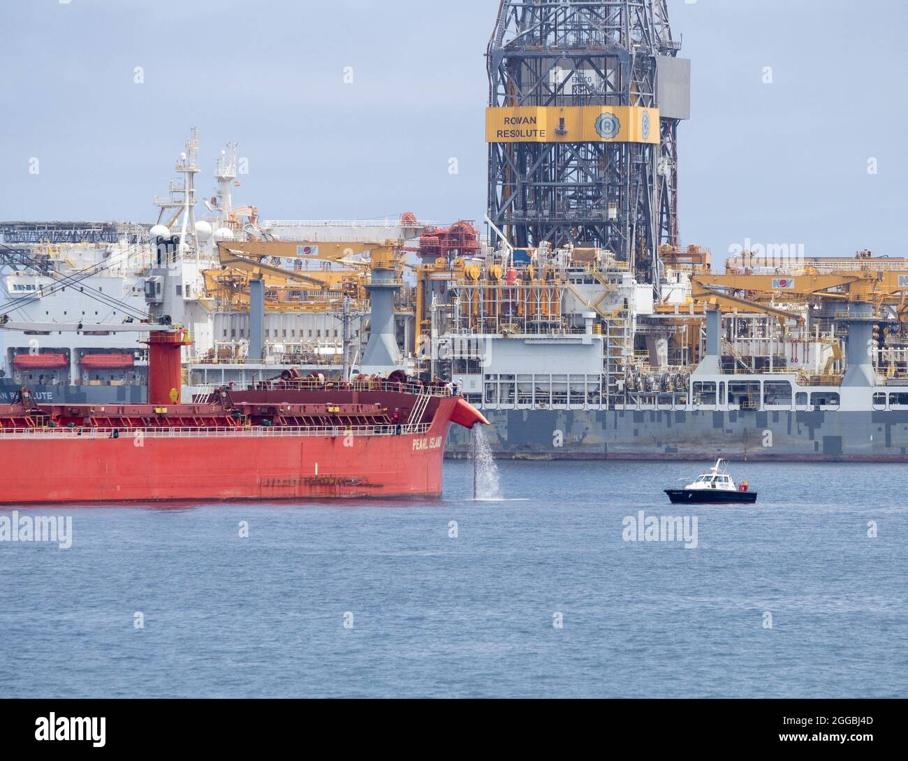 Oil tanker, large ship emptying ballast water as it enters port Stock ...