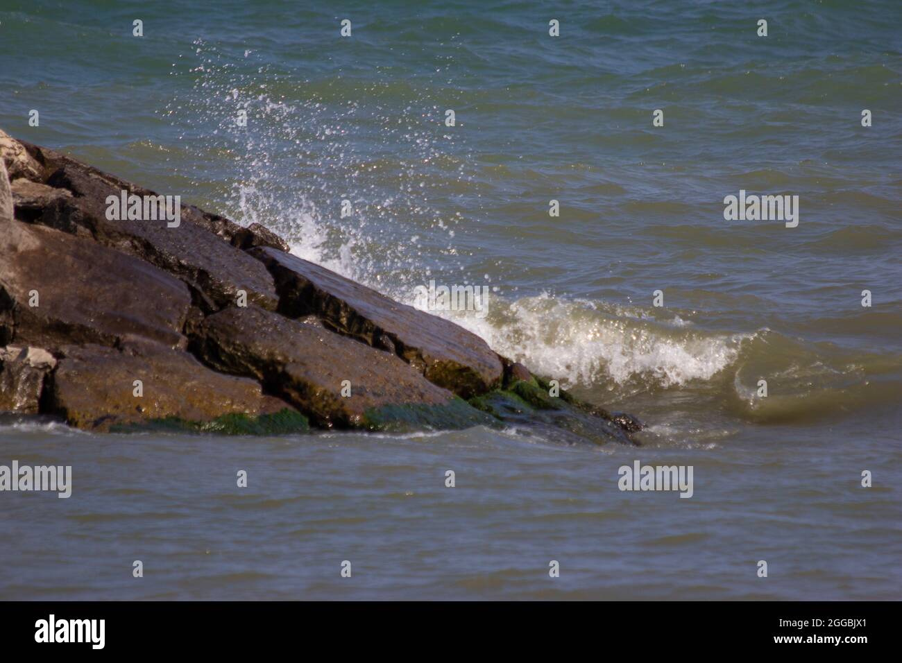 Waves crashing on Lake Ontario shore Stock Photo - Alamy