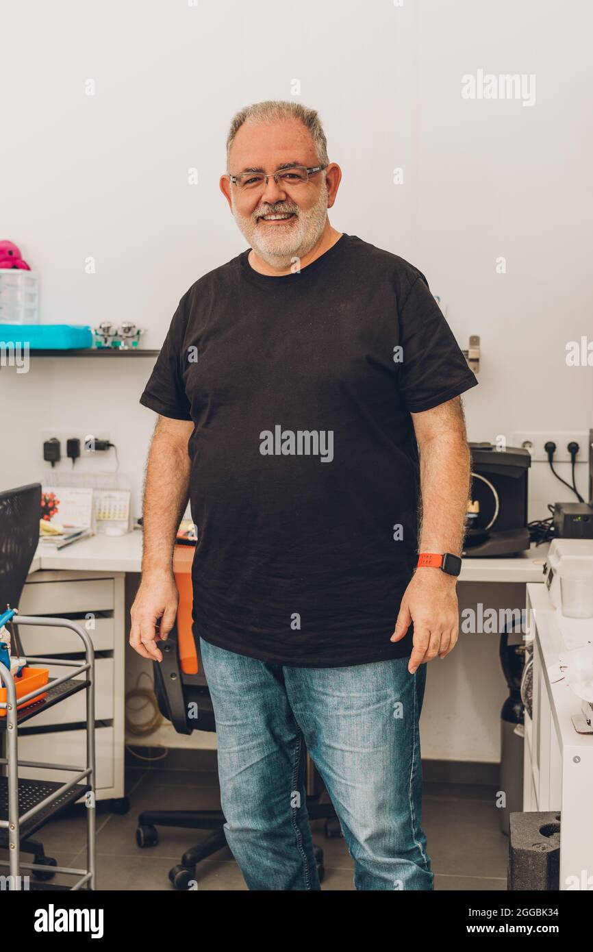 Portrait of a professional specialised in dental bone ceramics and ...