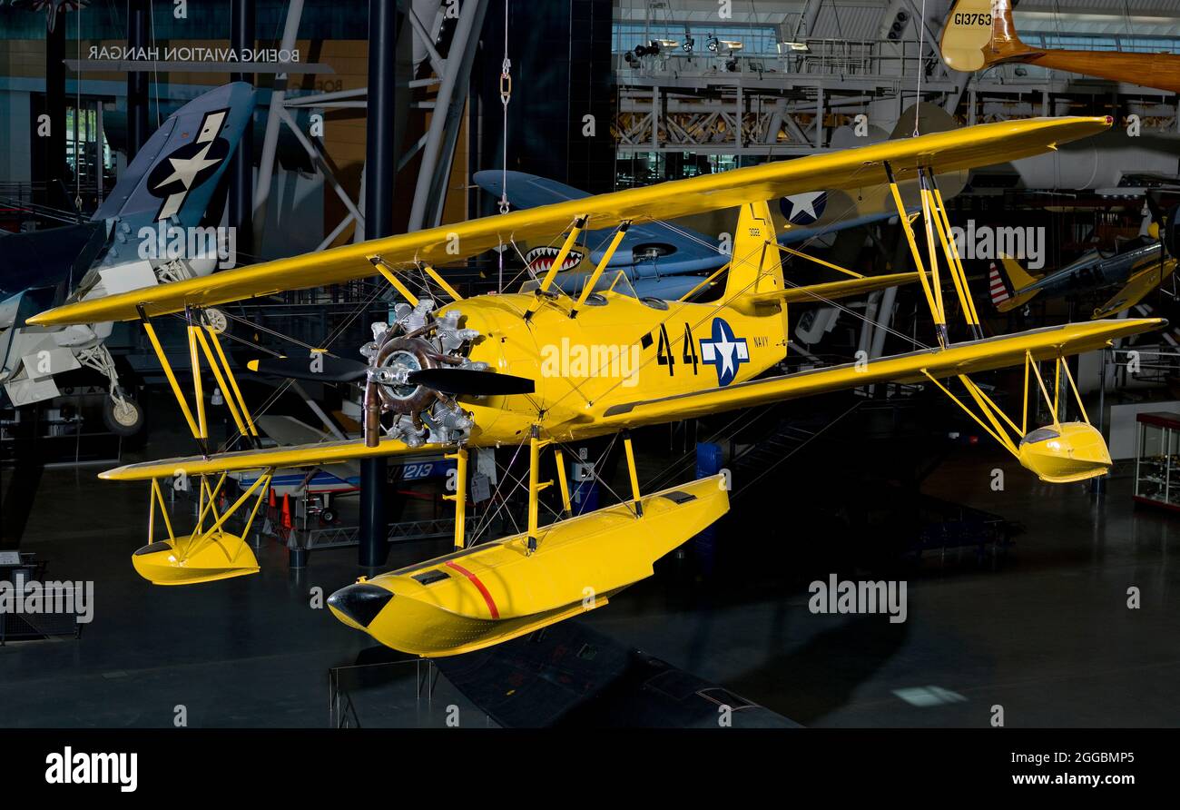 Bright yellow bi-plane, hand crank start. Cockpit instrumentation ...