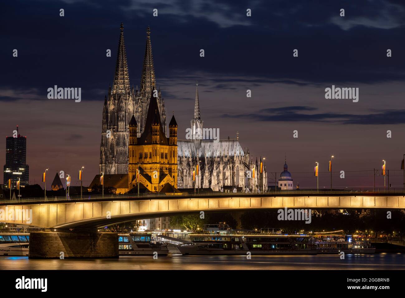Ancient buildings next to Rhine river illuminated in German city ...