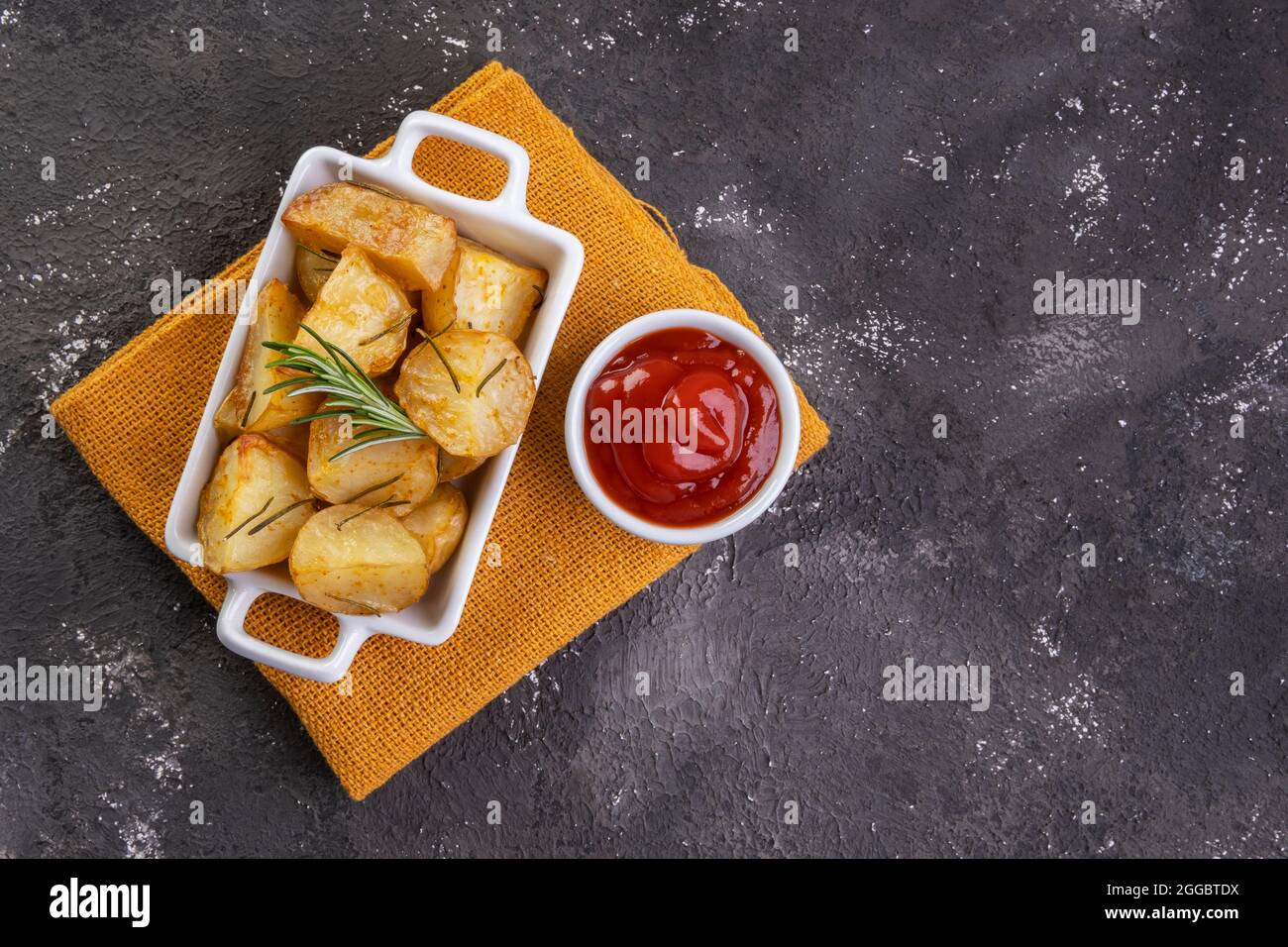 bowl of rustic fried and roasted potatoes with rosemary Stock Photo - Alamy