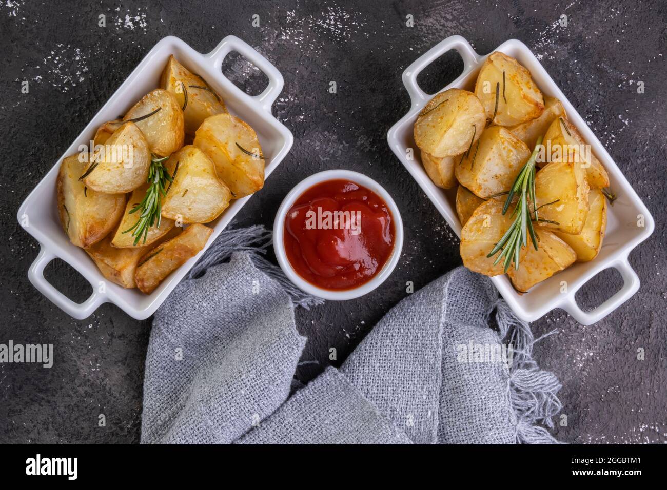 bowl of rustic fried and roasted potatoes with rosemary Stock Photo - Alamy